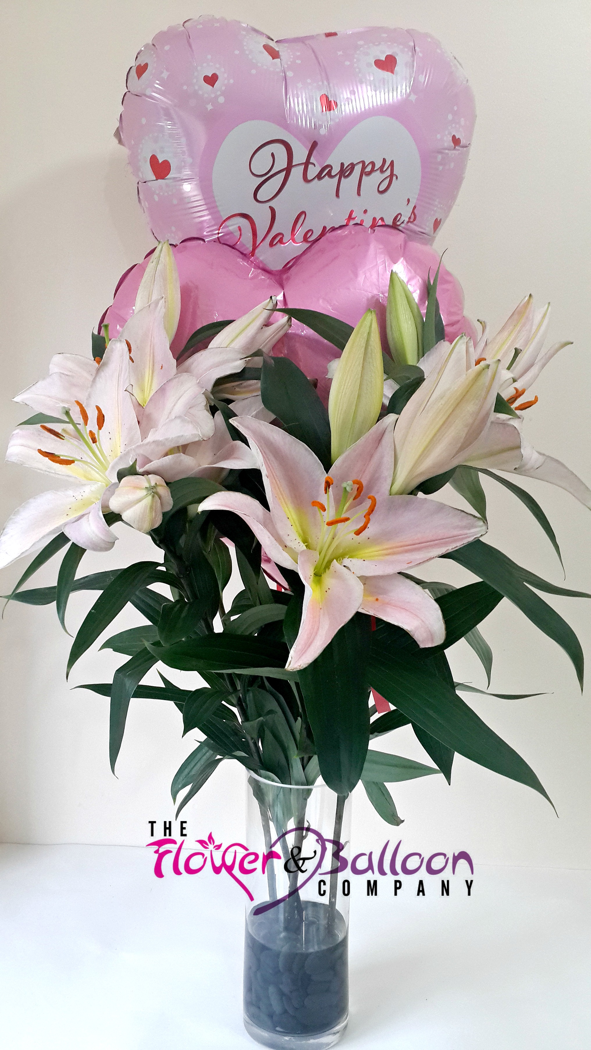 10 Long Stem Lilies and Balloon - flowerandballooncompany.com